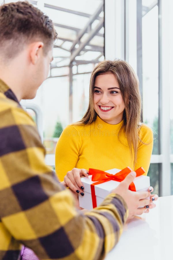 Image of Affectionate Boy Giving Her Girlfriend a Present when they ...