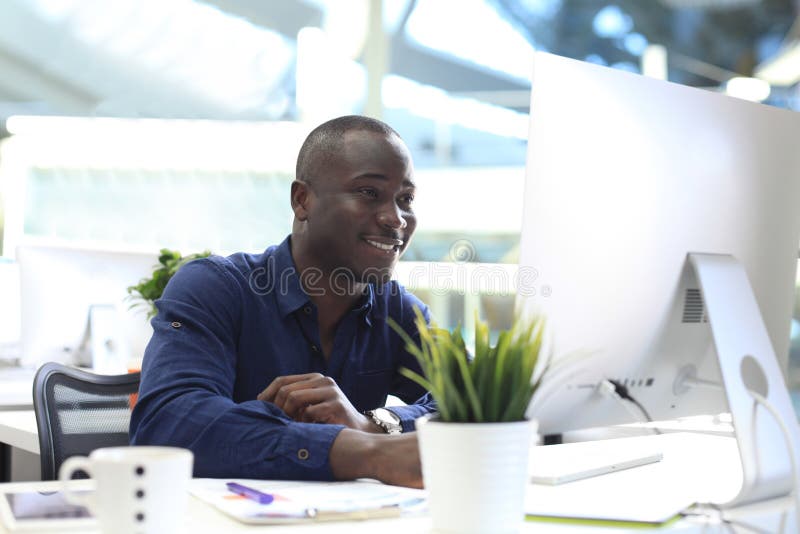 Image of African American Businessman Working on Computer Stock Photo ...