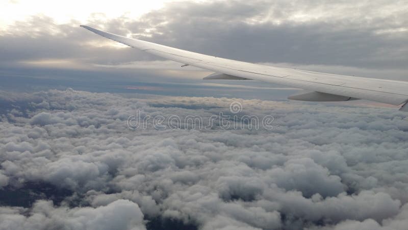 Airplane wing and Clouds stock image. Image of cloud - 120431497