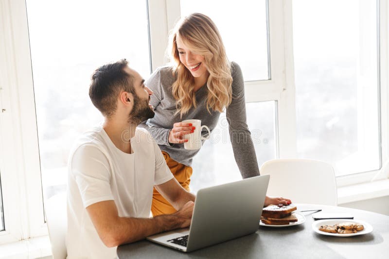 Amazing Young Loving Couple Sitting at the Kitchen Have a Breakfast ...