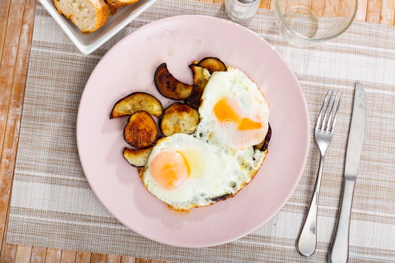 Appetizing Fried Eggs Made with Eggplants Stock Photo - Image of plate ...