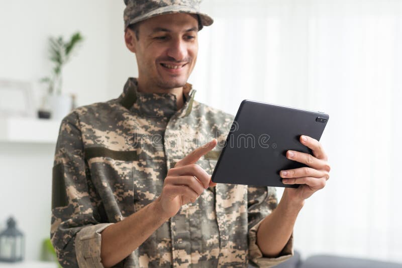 Image of Army Soldier Using Digital Tablet Against White Background ...