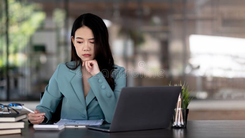 Image of an Asian Woman Who is Tired and Overthinking from Working with ...