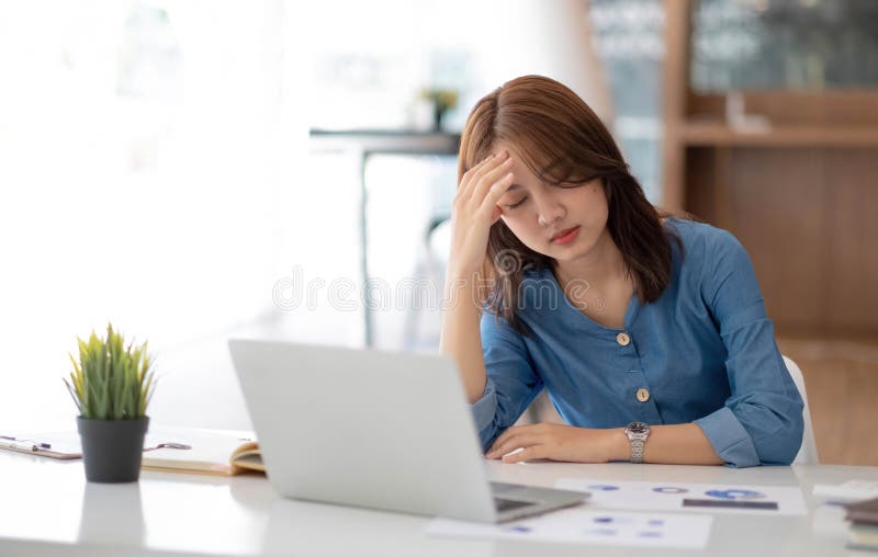 Image of an Asian Woman Who is Tired and Overthinking from Working with ...