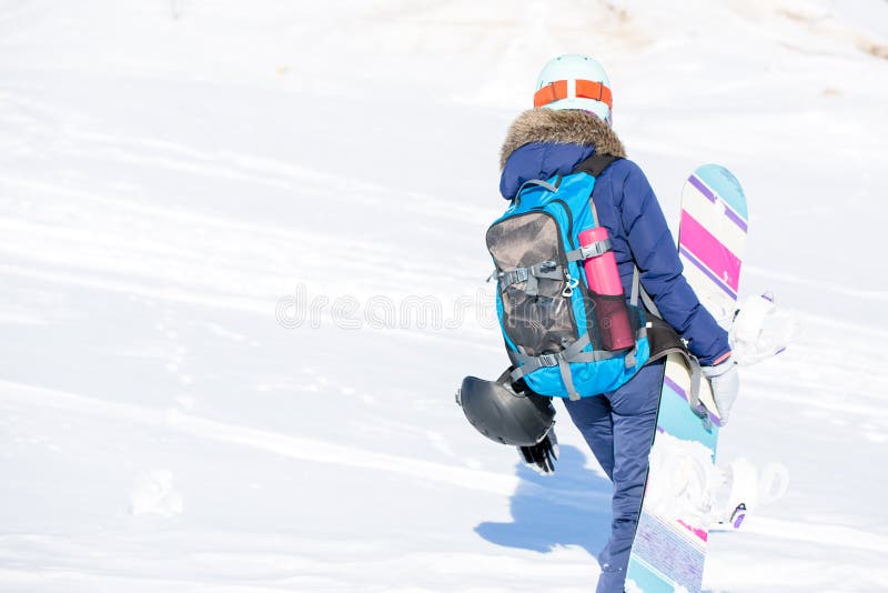 Image from Back of Woman in Helmet with Backpack and Snowboard Stock ...