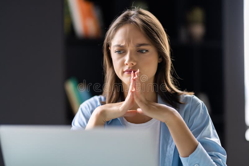 Beautiful Woman Thinking while Sitting at Table in Office Stock Photo ...