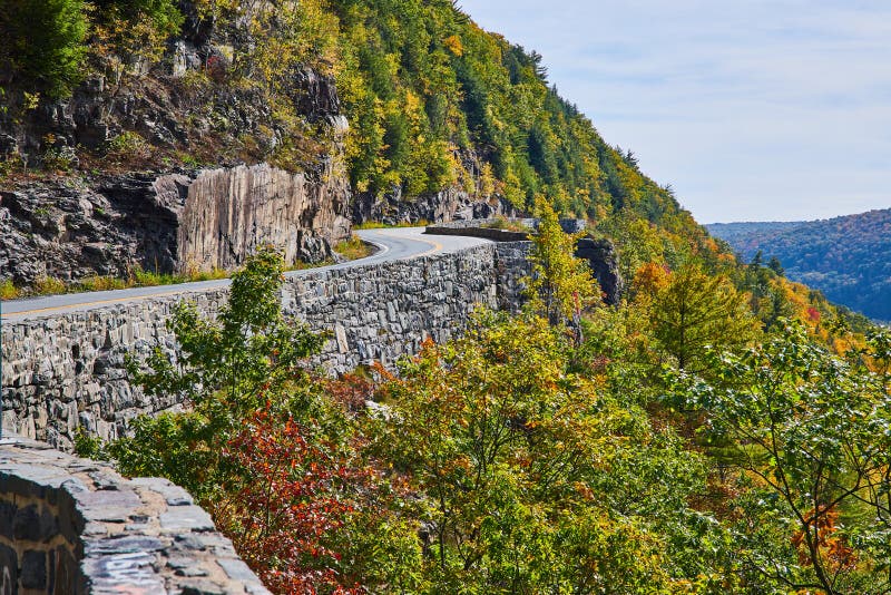 Beautiful Highway Winding through Cliffs and Mountains with Stone Wall ...