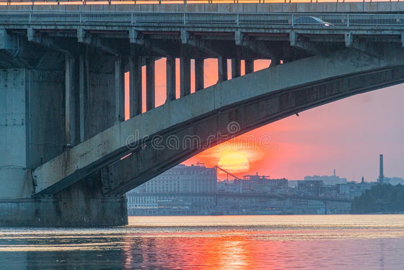 Image of a Beautiful Sunset Over a Long-span Arch Bridge with Two-way ...