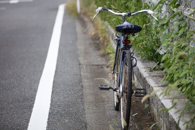 Bicycle left on the street editorial image. Image of tarmac - 245196165