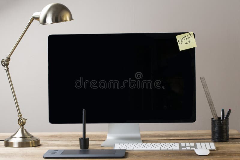 Image of a Big Computer Screen with a Lamp and Stationary Items Stock ...