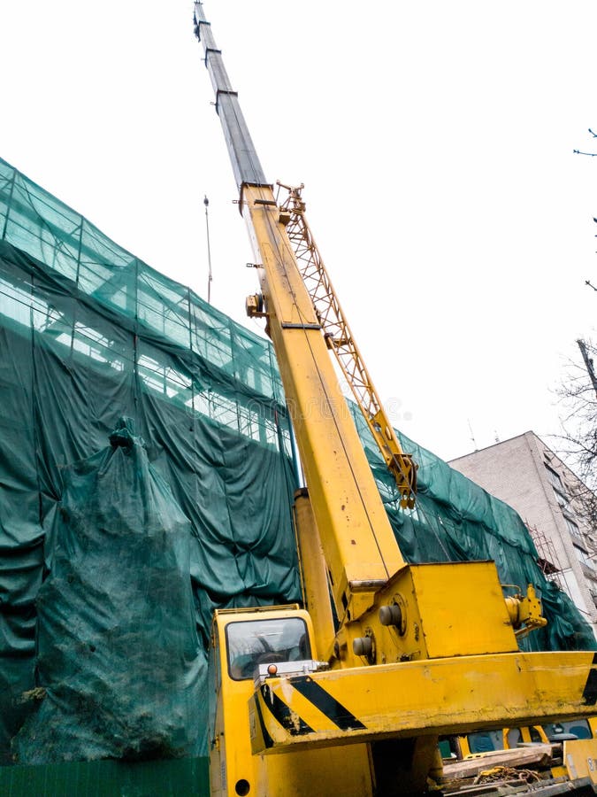 Image of Big Mobile Crane Working on Building Site Stock Photo - Image ...