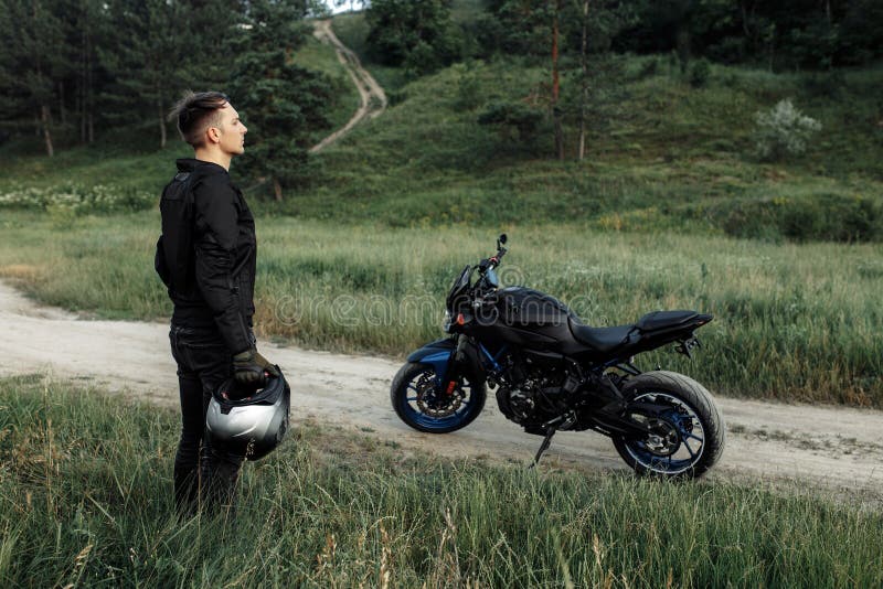 Image of Biker and Motorcycle on the Country Road. Stock Photo - Image ...