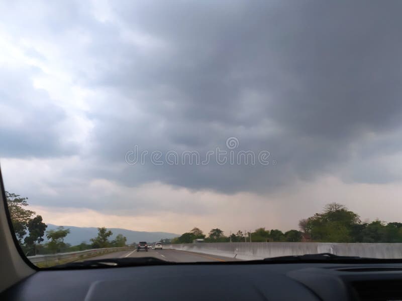 Image of Black Clouds Taken from Inside a Moving Car. Stock Photo ...