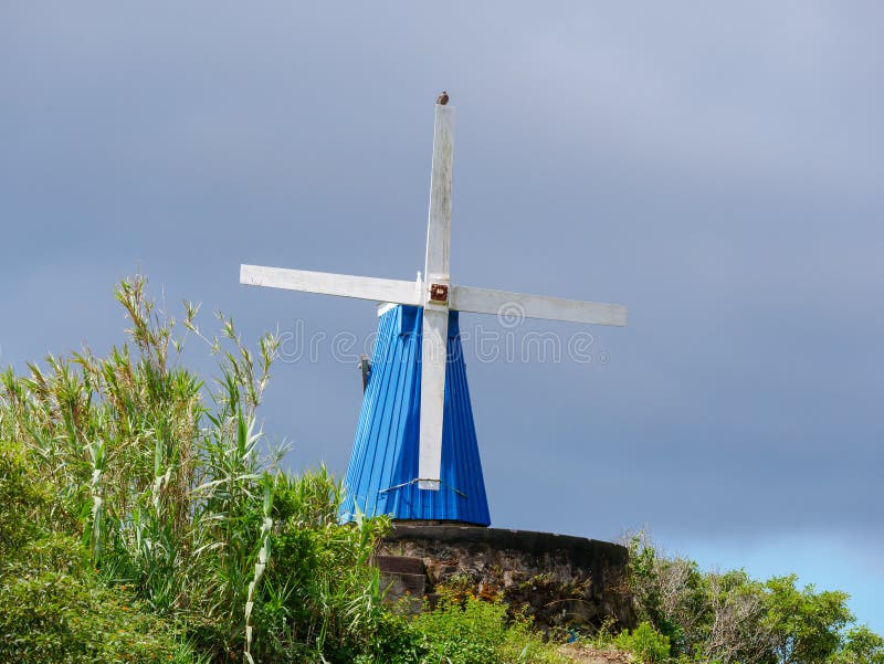 Image of Blue Wooden Wind Mill on a Stone Base Stock Photo - Image of ...