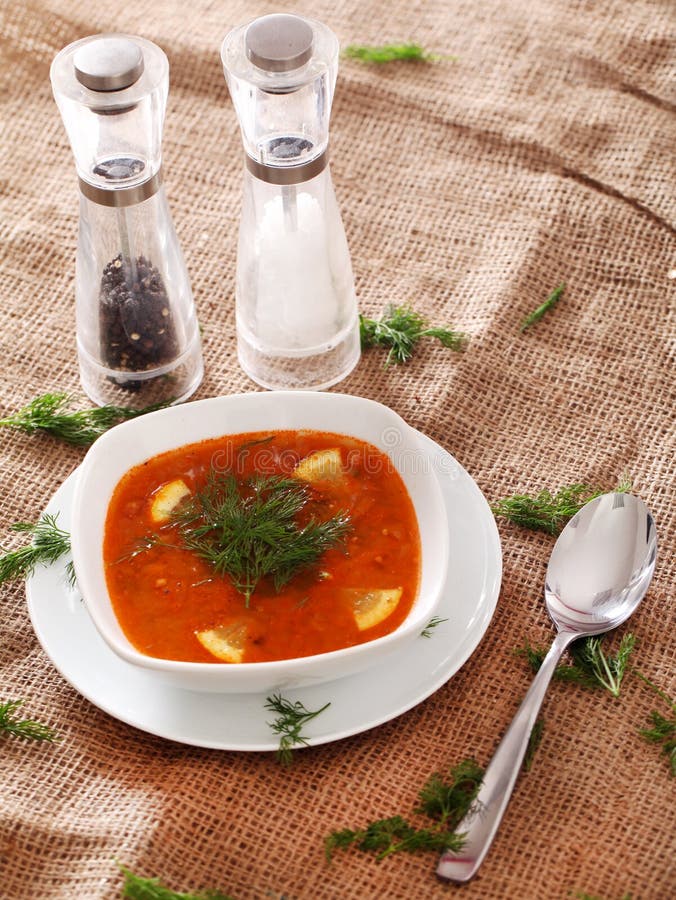 Image of Bowl of Hot Red Soup Served with the Salt, Pepper and S Stock ...