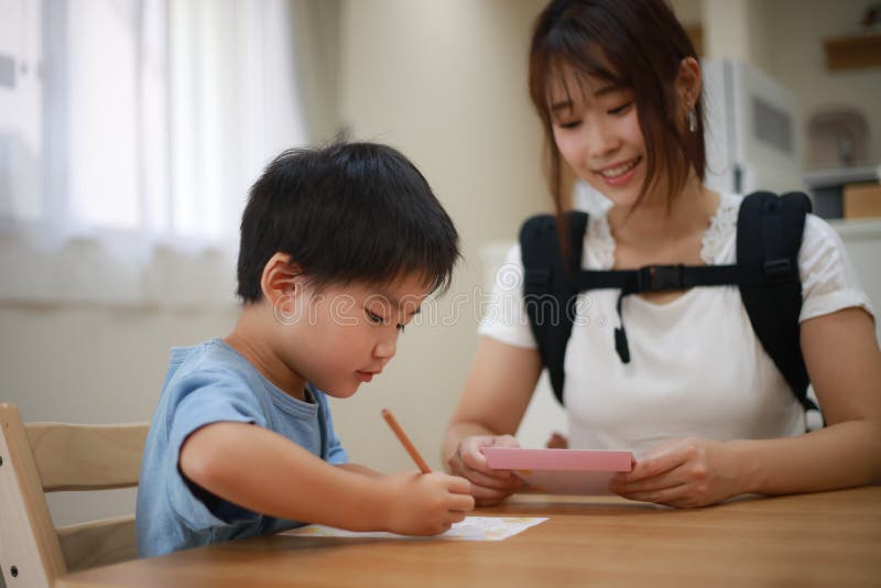 Boy writing a letter stock image. Image of indoors, pencils - 248725093