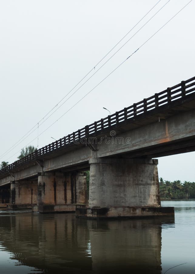 The Image is of a Bridge Over Water. it Features an Outdoor Scene with ...