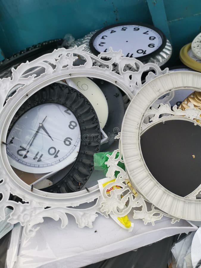 Broken Pieces of Wall Ceiling Clock at the Dumpster. Stock Image ...