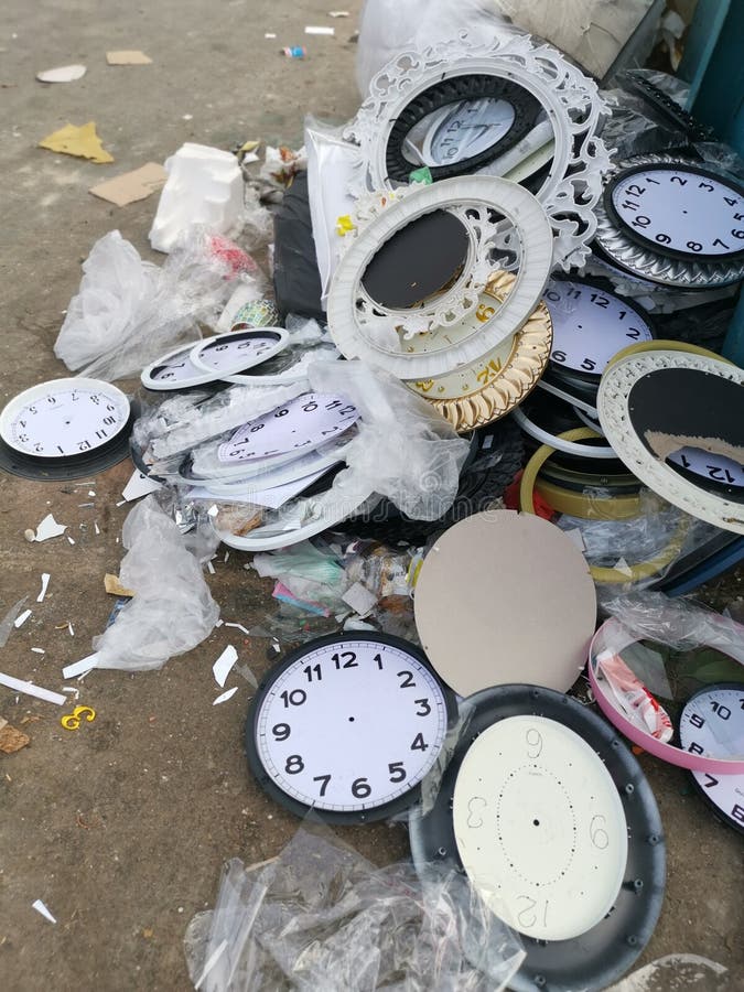 Broken Pieces of Wall Ceiling Clock at the Dumpster. Stock Image ...