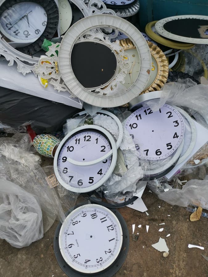 Broken Pieces of Wall Ceiling Clock at the Dumpster. Stock Image ...