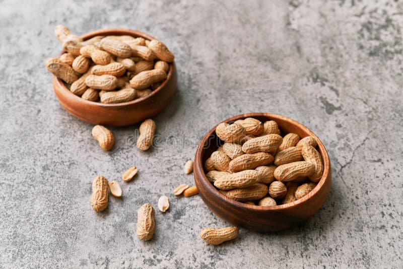 Image of Bunch of Peanuts in a Bowl on a Concrete Surface Stock Photo ...