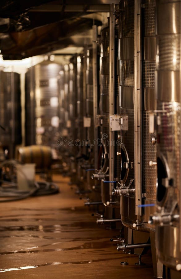 The Inside of a Wine Brewery with Many Racks and a Small Tank Stock ...