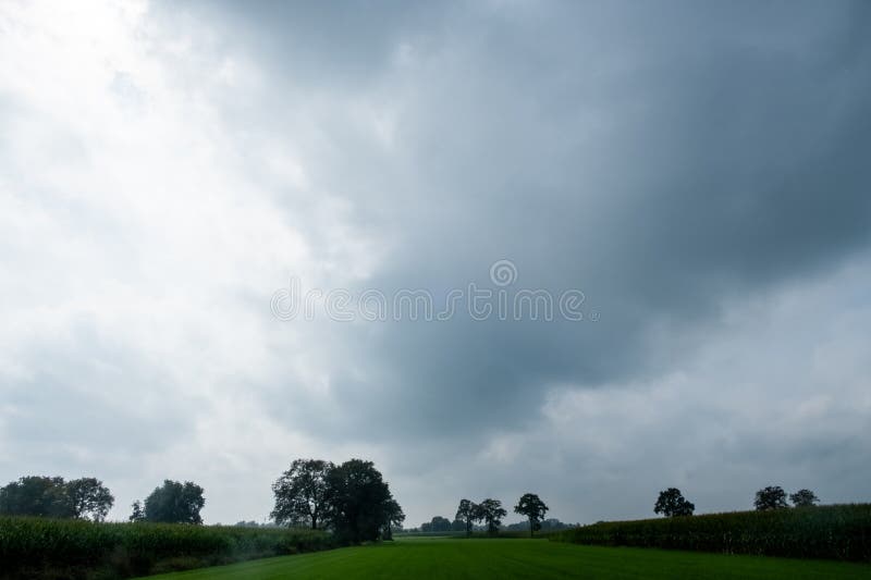 Approaching Storm Over Tranquil Fields Stock Image - Image of ...