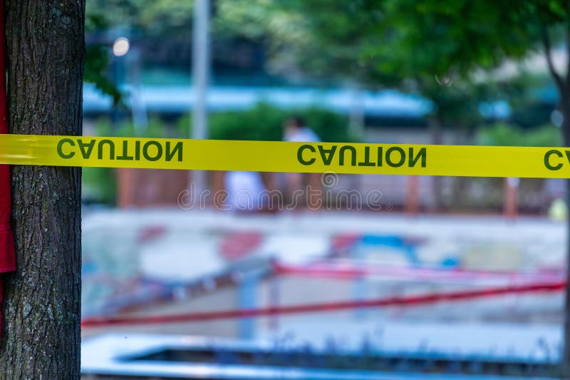 Image of a Caution Tape Around Tree Blocking Access To a Crime Scene ...