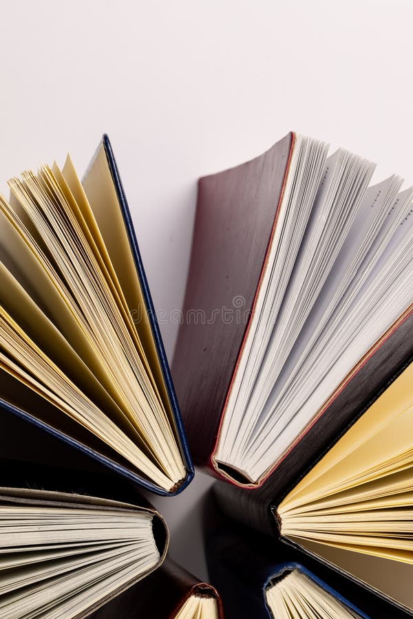 Image of Central Composition with Books Standing on White Surface Stock ...