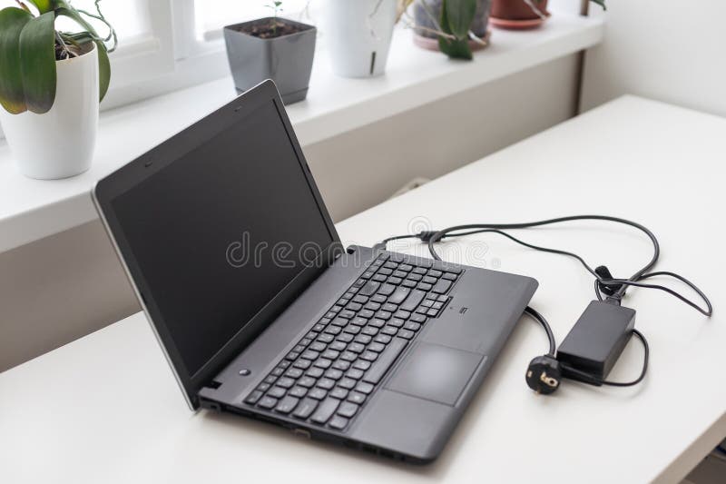 Image of charging a laptop stock photo. Image of screen - 293805120