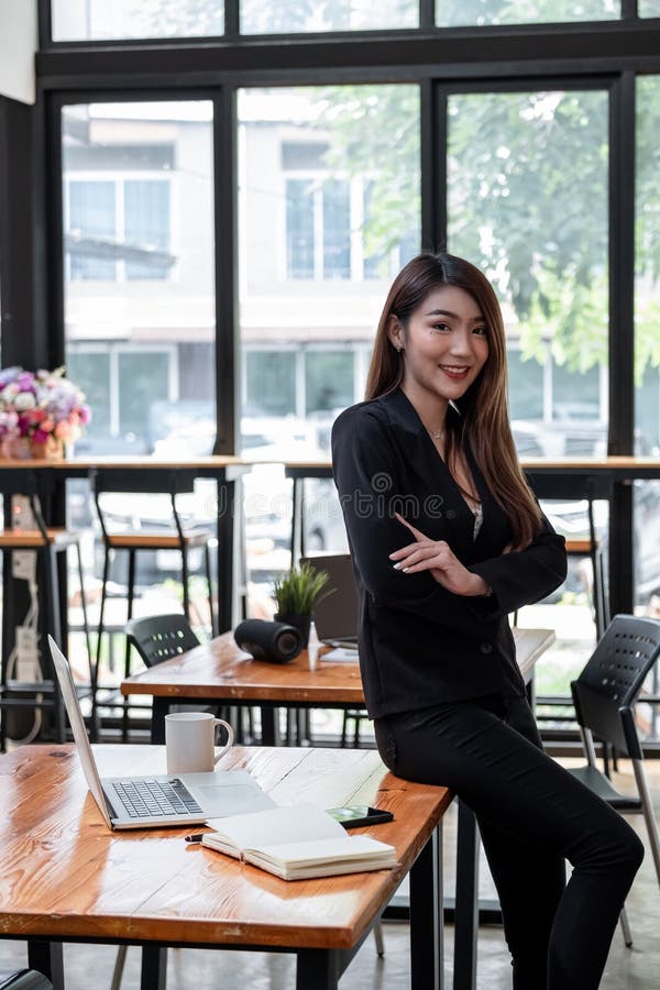 Image of a Charming Young Asian Businesswoman Standing at the Office ...
