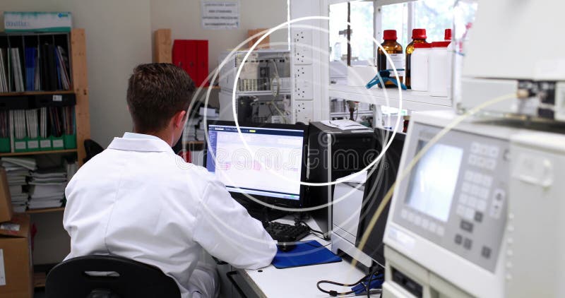 Image of Circles Spinning Over Male Scientist Using Computer Stock ...