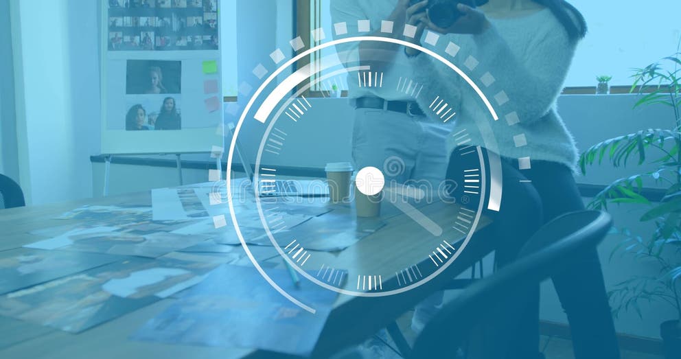 Image of Clock Ticking Over Diverse Business People in Office Stock ...