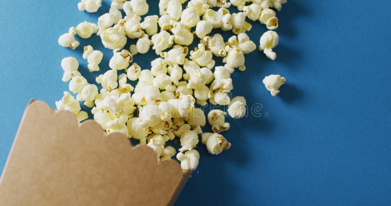 Image of Close Up of Box of Popcorn on Blue Background Stock Image ...