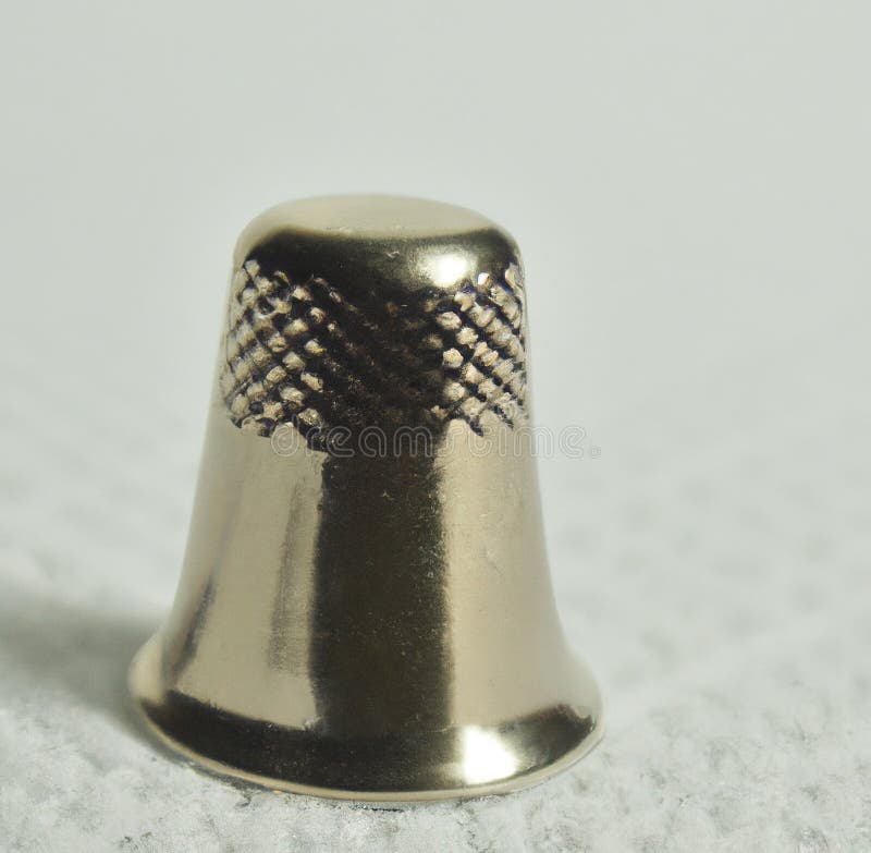 Image of Close Up of Silver Thimble on Grey Patterned Fabric Background ...