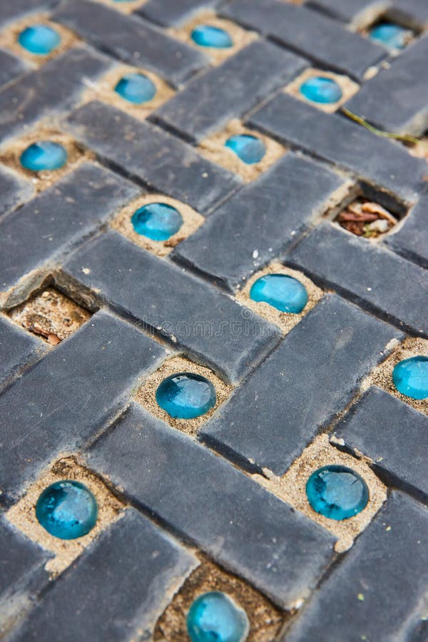 Close Up View of Path with Alternating Black Bricks with Varying and ...