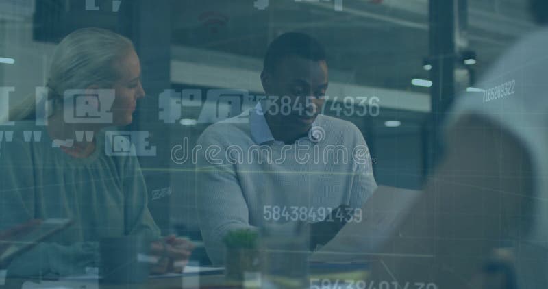 Image of Colleagues Discussing Project Details at Office Table with ...