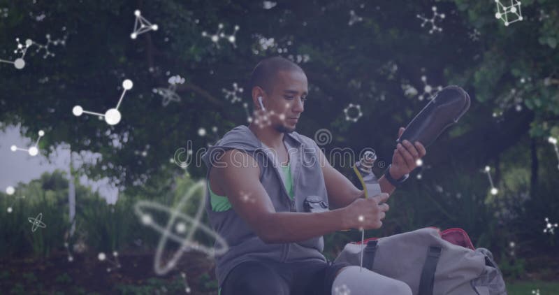 Image of Communication Networks Over Disabled Male Athlete Attaching ...