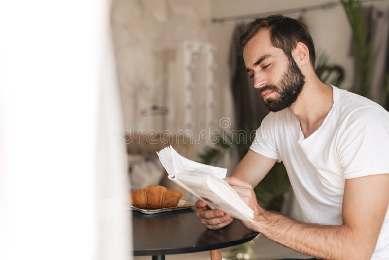 Man Indoors at Home Have a Breakfast Reading Book Stock Photo - Image ...