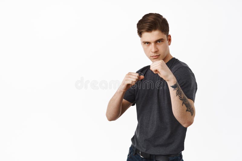 Image of Confident Young Man Ready for Fight, Standing in Boxing ...