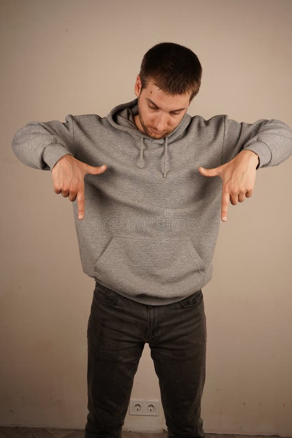 The Image Conveys Clarity and Purpose. Pointing Down with Both Hands ...