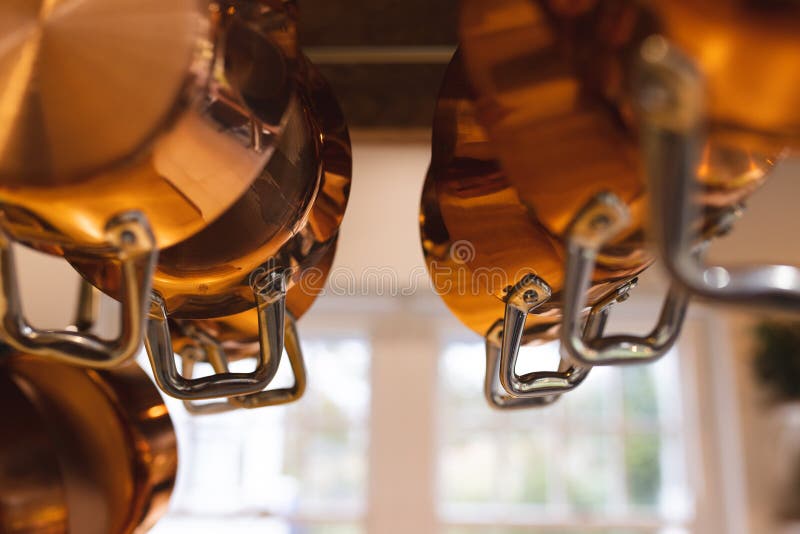 Image of Copper Pots and Plates Hanging in Kitchen Stock Image - Image ...