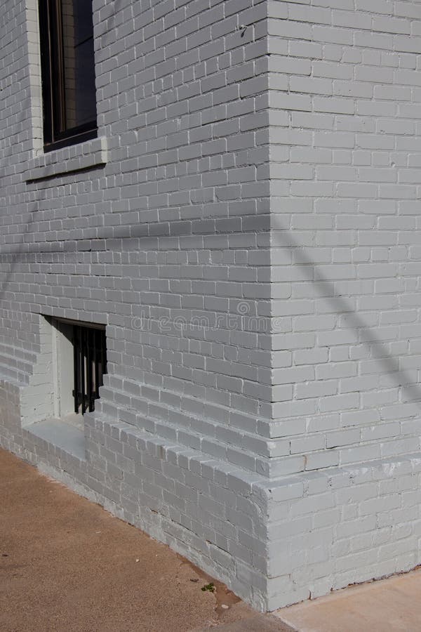 A Corner View of a Brick Building Painted Grey Stock Photo - Image of ...