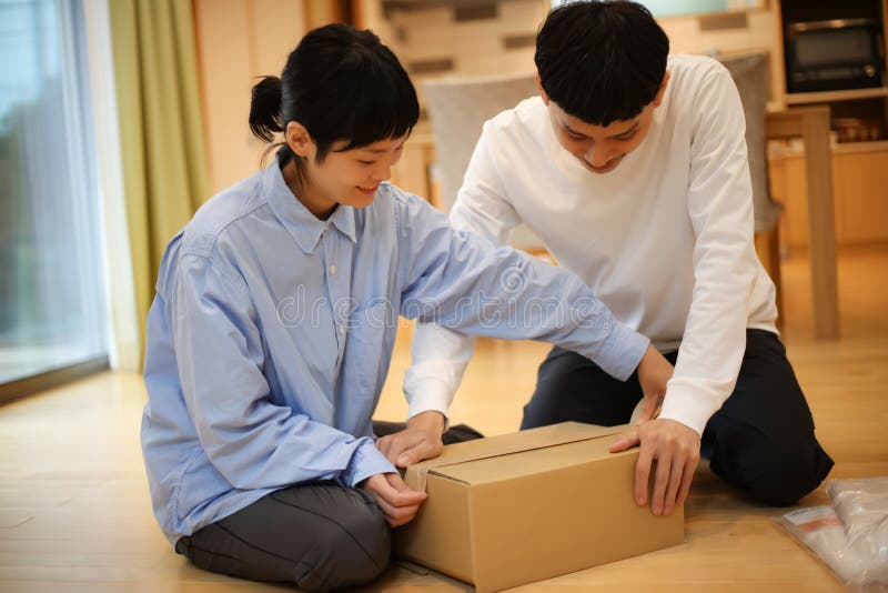 Couple working on packing stock image. Image of courier - 244462099