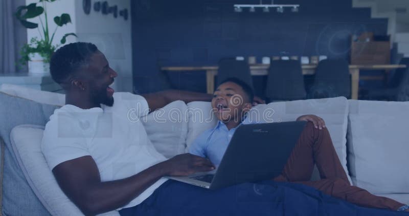 Image of Data Over Happy African American Father and Son Using Laptop ...