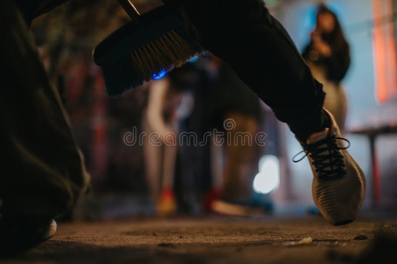 Person Sweeping a Urban Setting with Detail on Motion and Evening ...