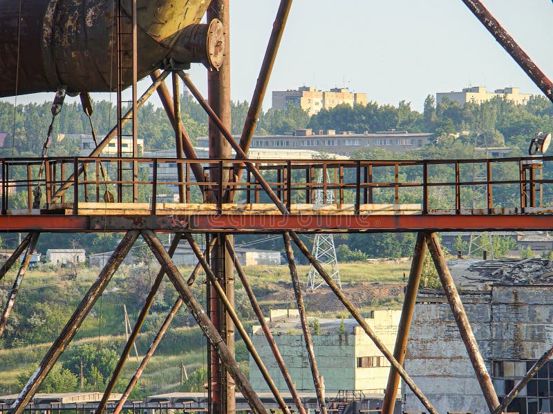 Image Depicts an Abandoned Industrial Structure with Vegetation ...