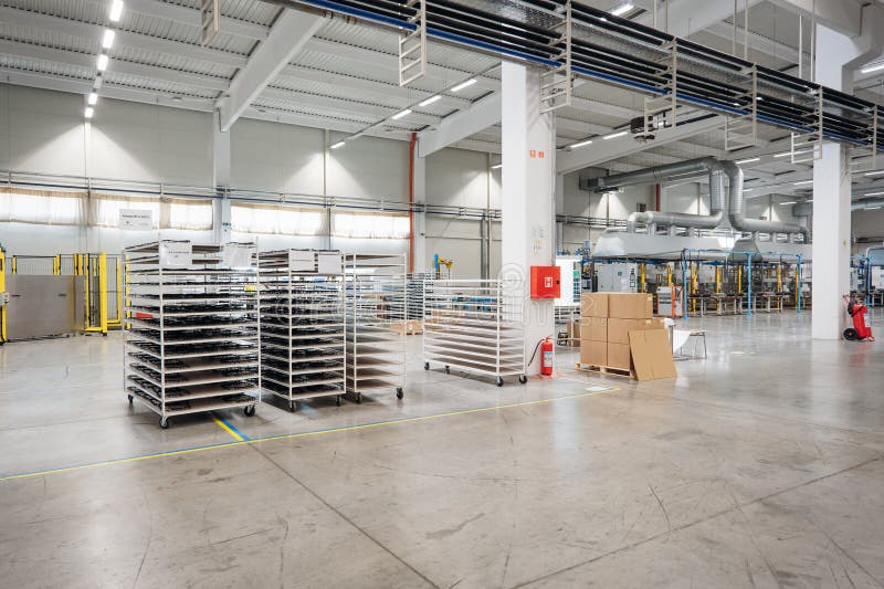 Spacious Factory Interior with Equipment Shelves and Boxes Showcasing ...