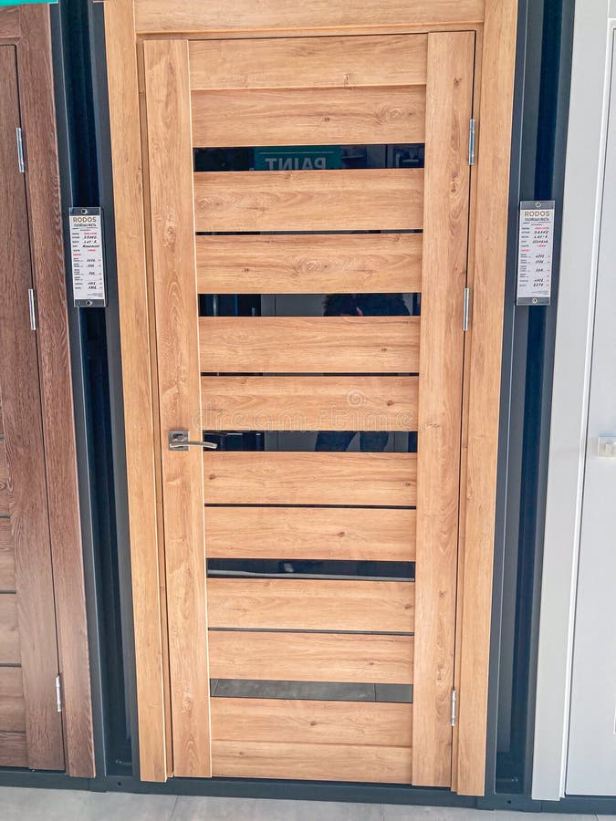 Image Depicts a Light-colored Wooden Door with Interlocking Design ...