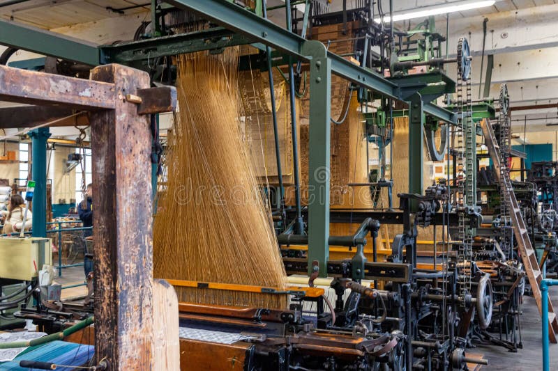 A Textile Mill with Several Weaving Looms and a Wooden Floor Stock ...